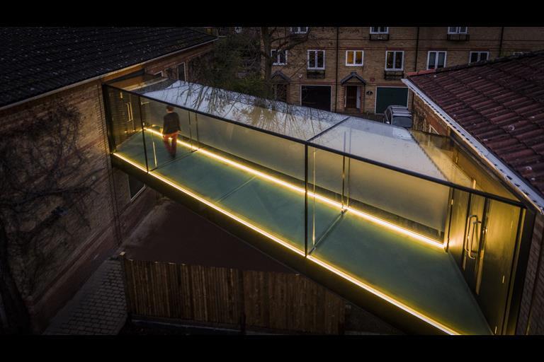 Paul Vick Architects completes 15m-long glass bridge for global ...